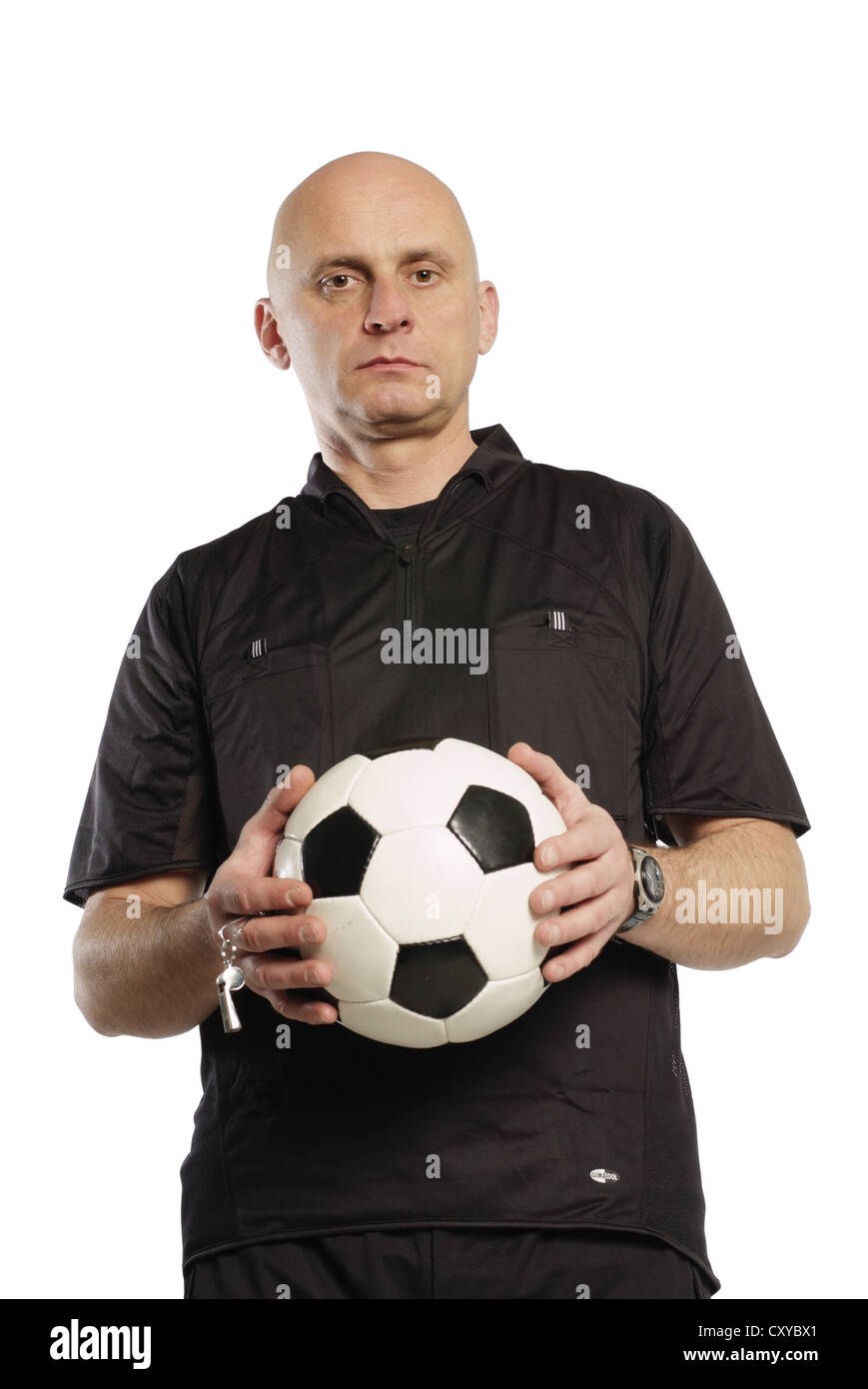 Referee holding a football Stock Photo - Alamy