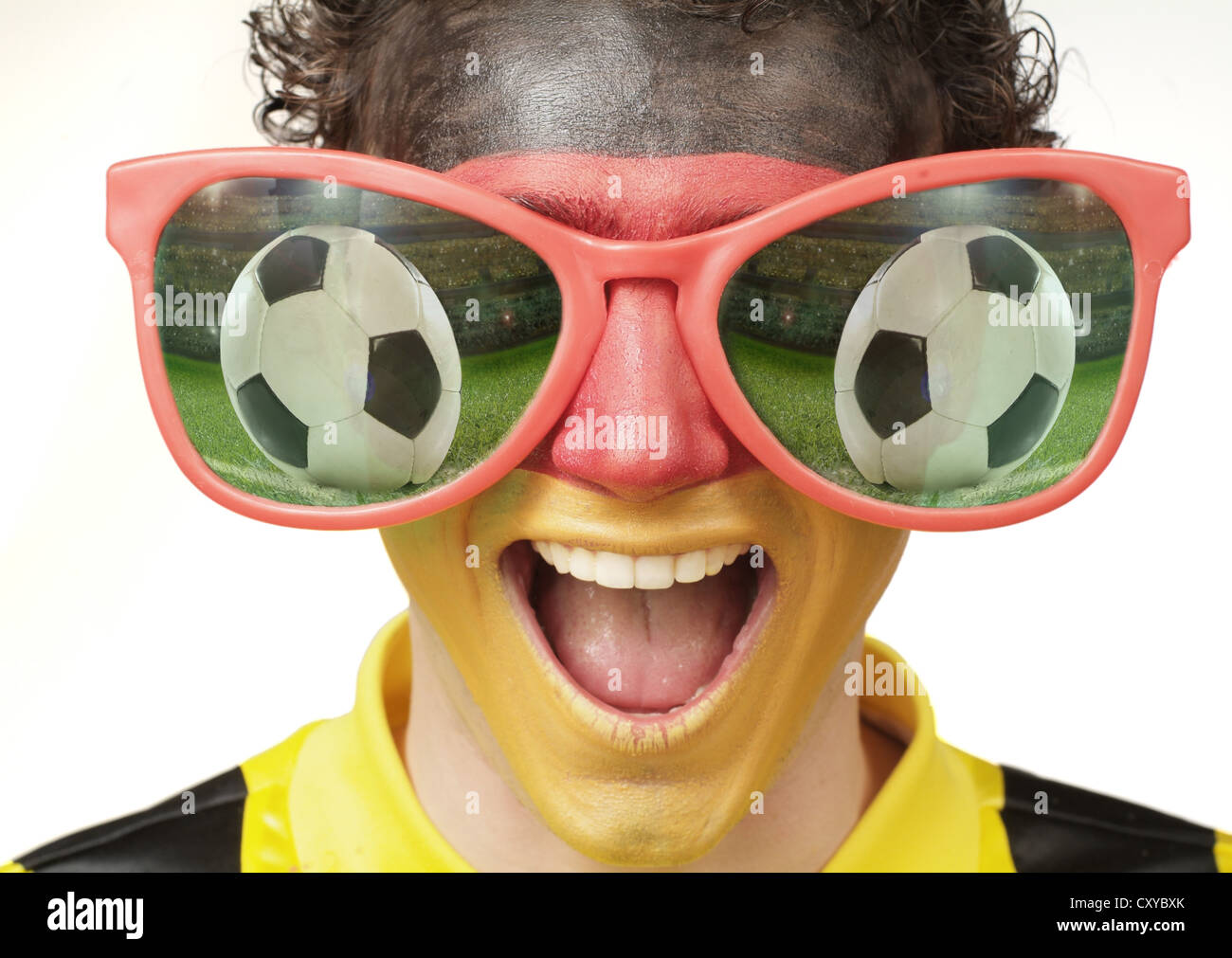 Fans wearing football colors colours hi-res stock photography and ...