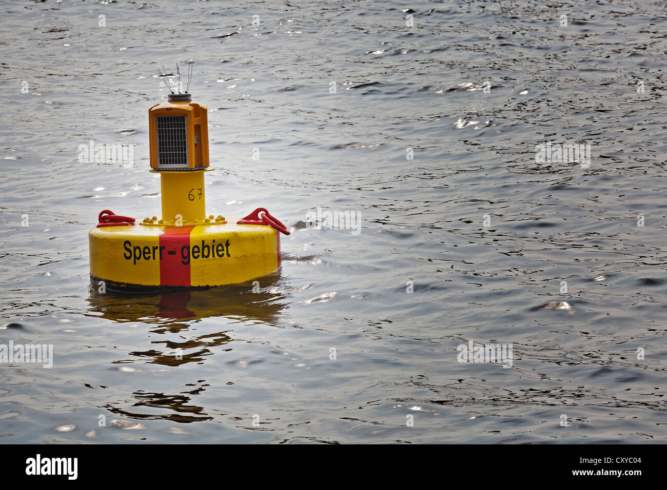 Yellow buoy in the harbour basin of Hamburg, Hamburg Stock Photo - Alamy
