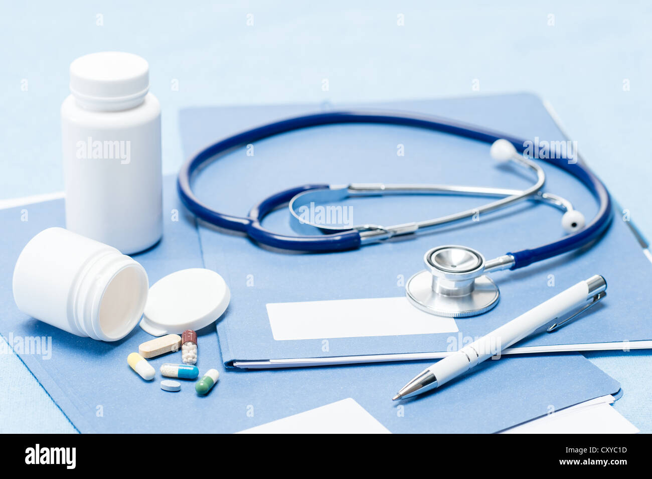 Medical equipment stethoscope, pen and medication over documents Stock ...