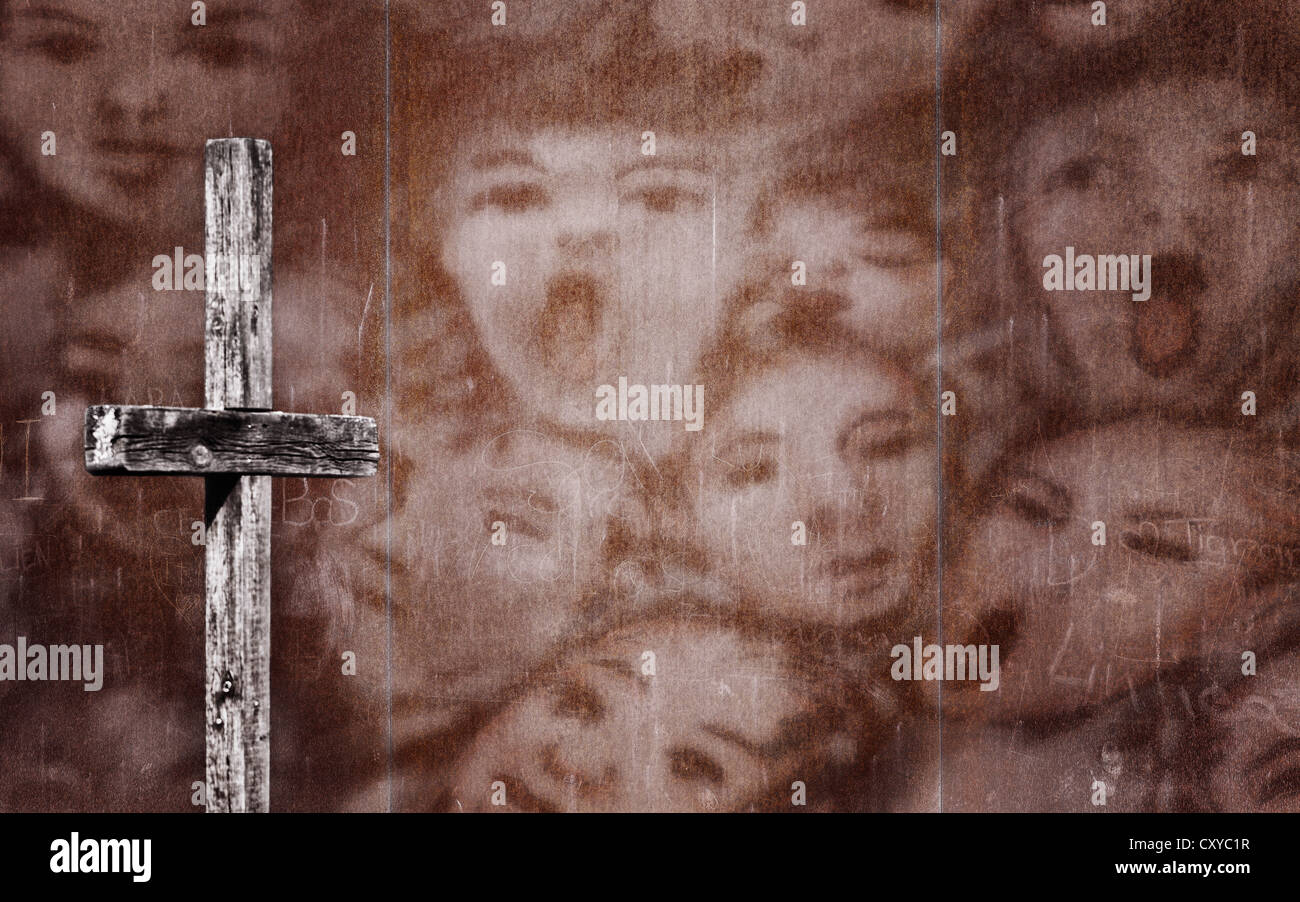 Wooden cross in front of a rusty wall with a drawing of screaming ...