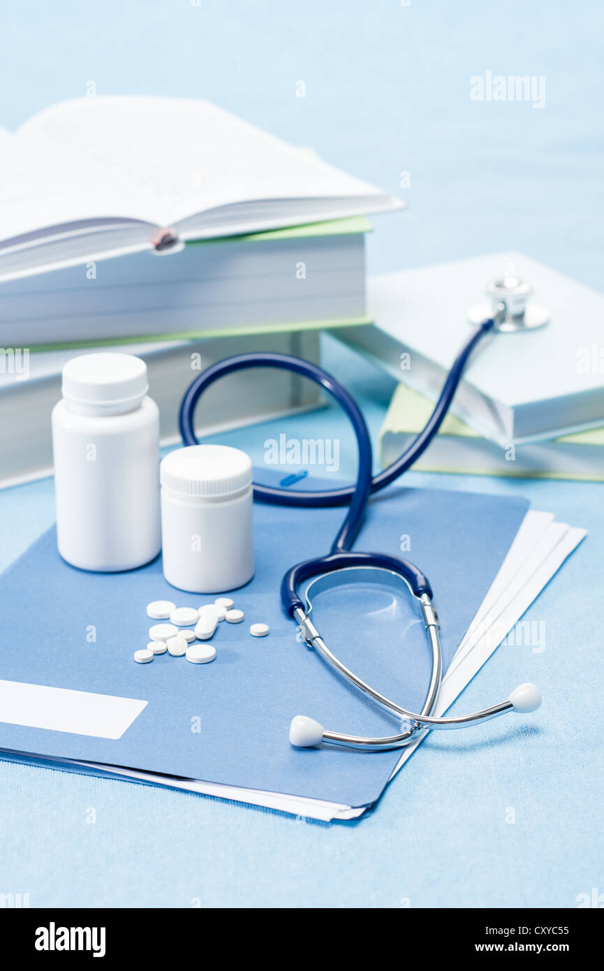 Doctor accessories with medical pills on blue background Stock Photo ...