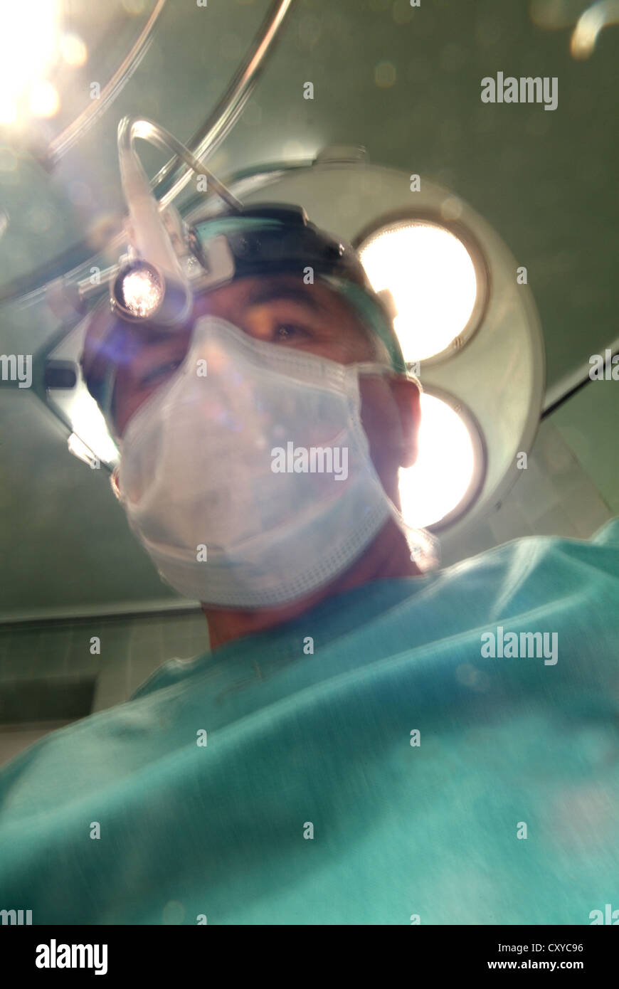 Surgeon wearing a face mask during surgery Stock Photo - Alamy