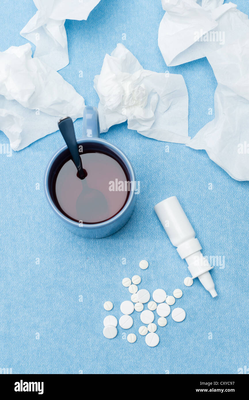 Cold illness medicaments, tea and tissues on blue background Stock ...