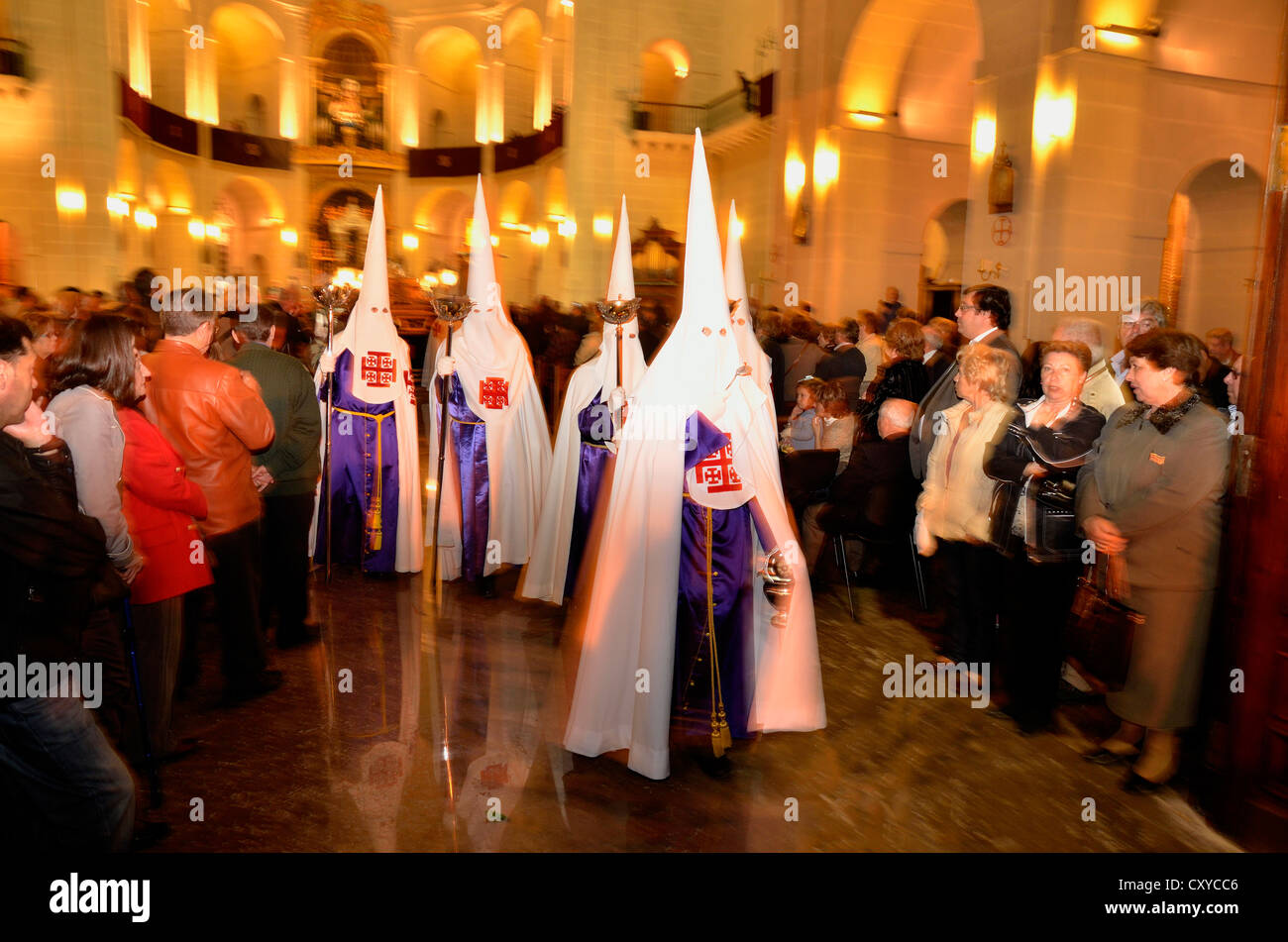 Penitents, Nazarenos, in their typical hooded robes during the ...