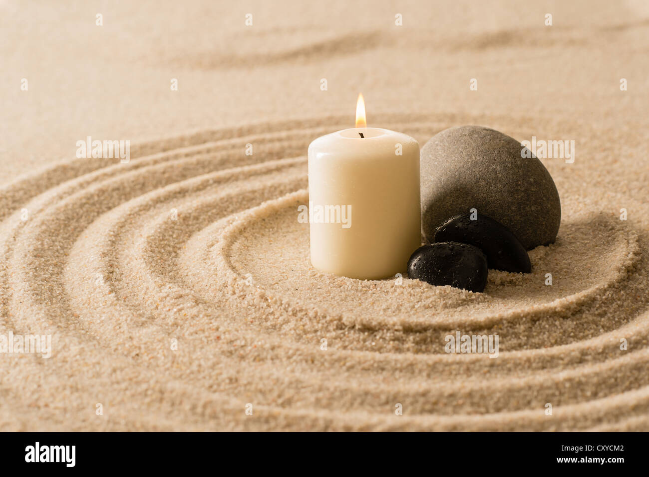 Spa atmosphere candle with zen stones in sand still nature Stock Photo ...