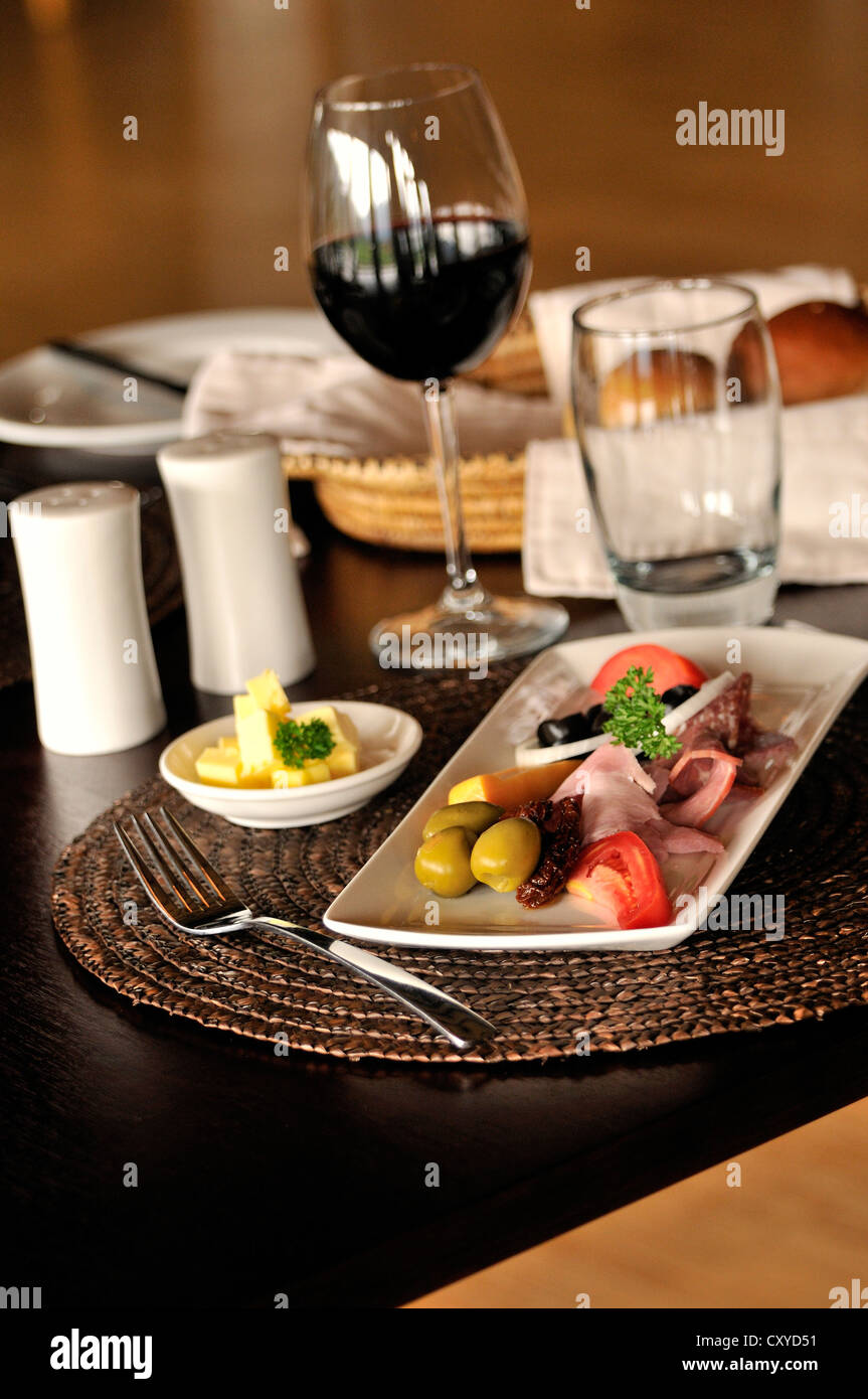Red wine and appetisers in the restaurant of the Nyungwe Forest Lodge ...