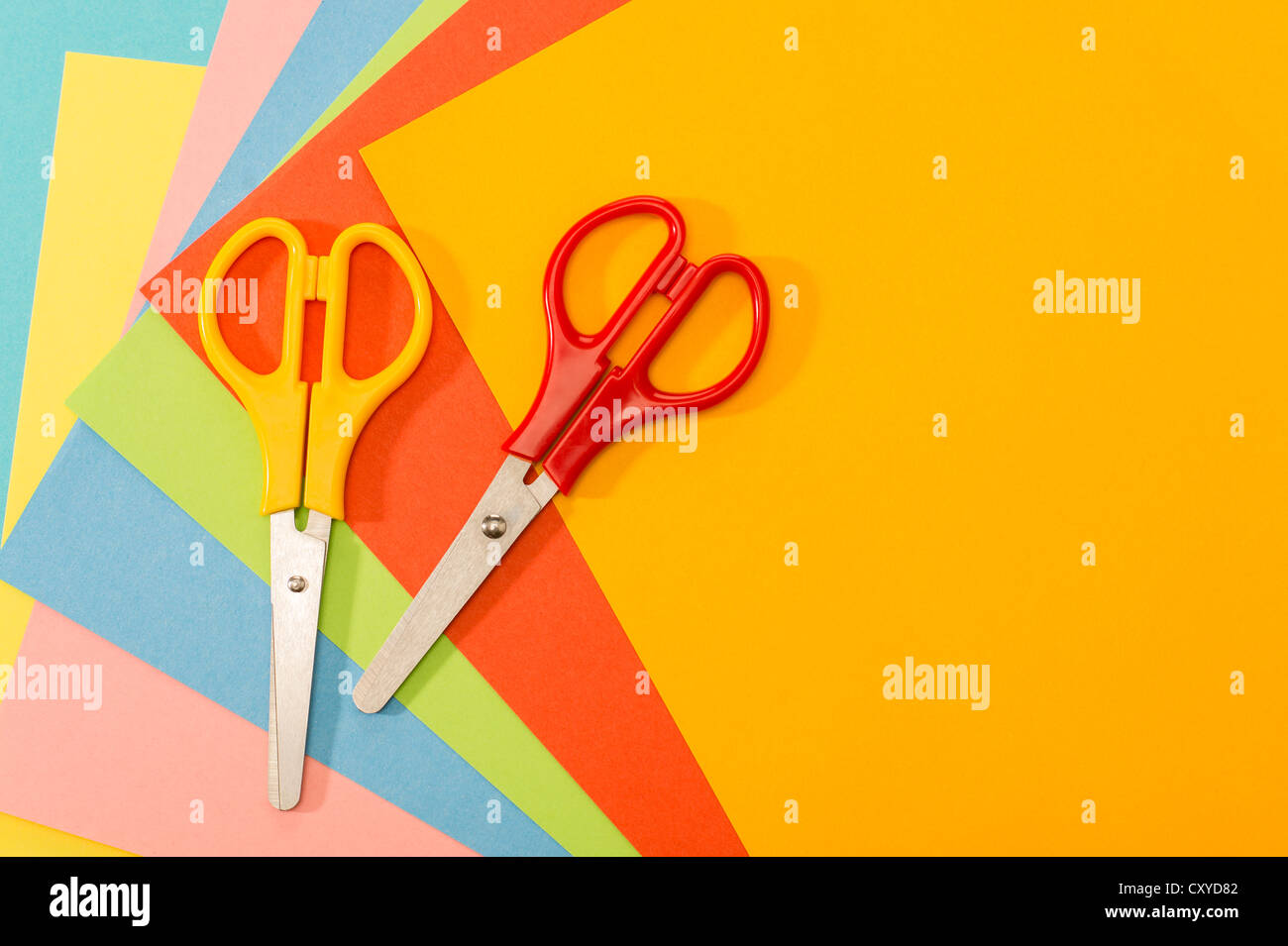 Color papers with scissors school paperwork art Stock Photo - Alamy