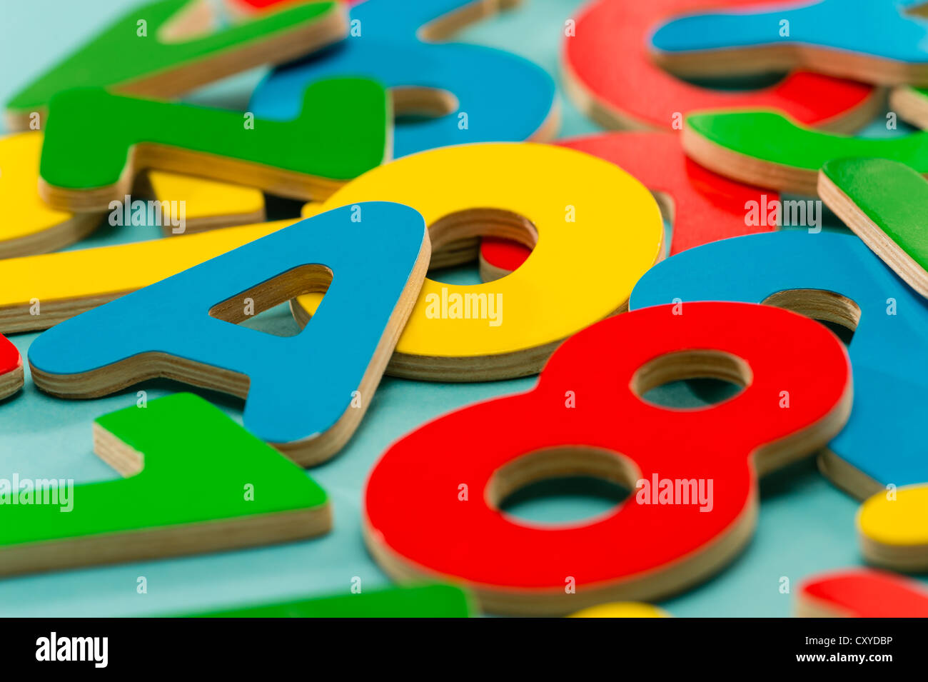 Colored wooden numbers and letters for school children Stock Photo - Alamy