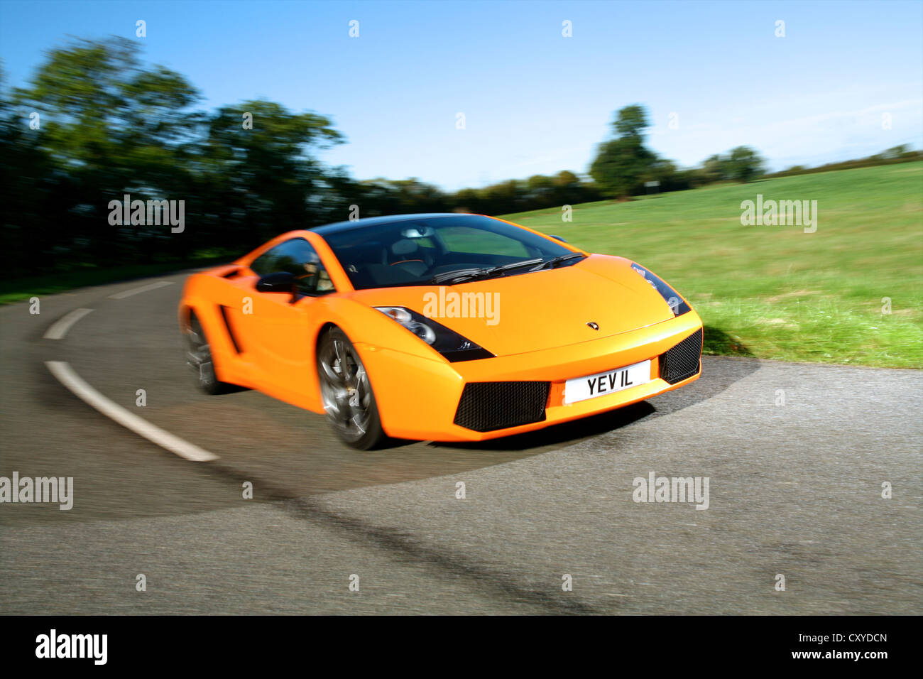 Front 3/4 of Lamborghini Gallardo driving around corner Stock Photo - Alamy