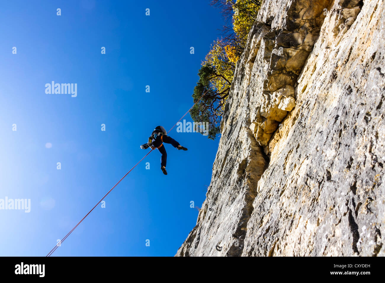 Climber abseiling, Schauenburgfluh Mountain, Basel Jura, canton of ...