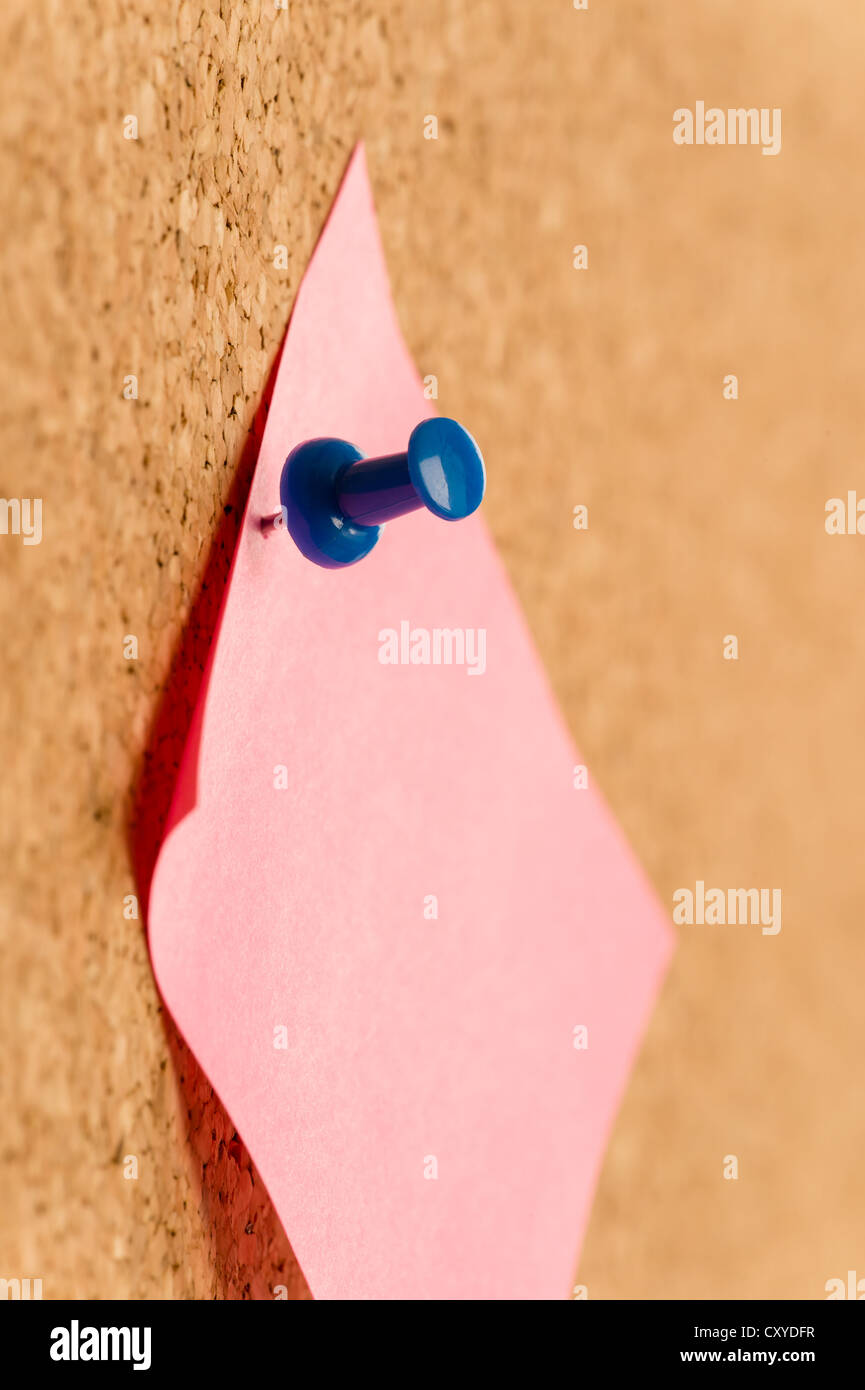 Post-it pink sticker note with pin on board close-up Stock Photo - Alamy