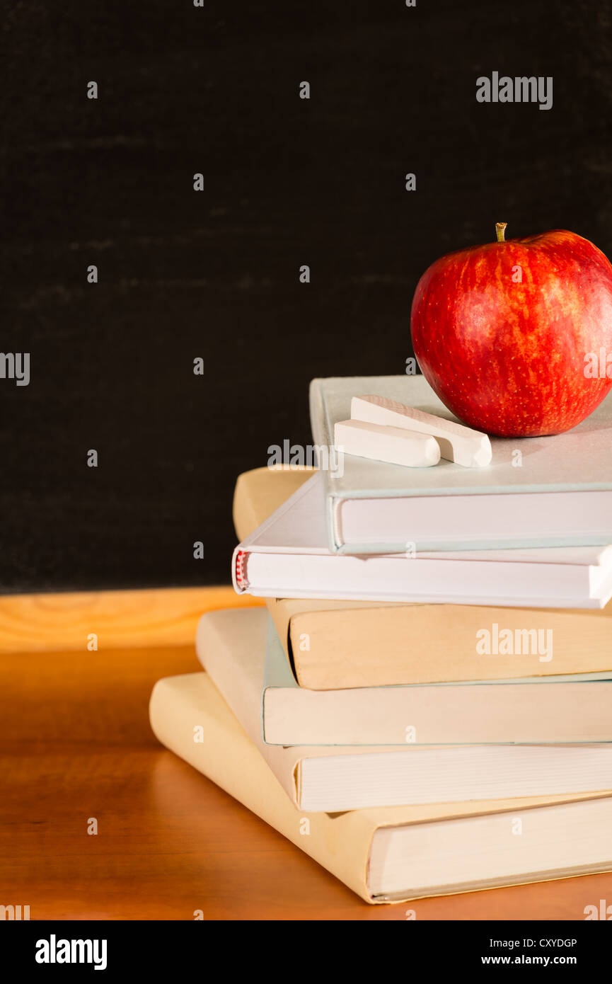 Traditional academic study pile of school books and apple Stock Photo ...
