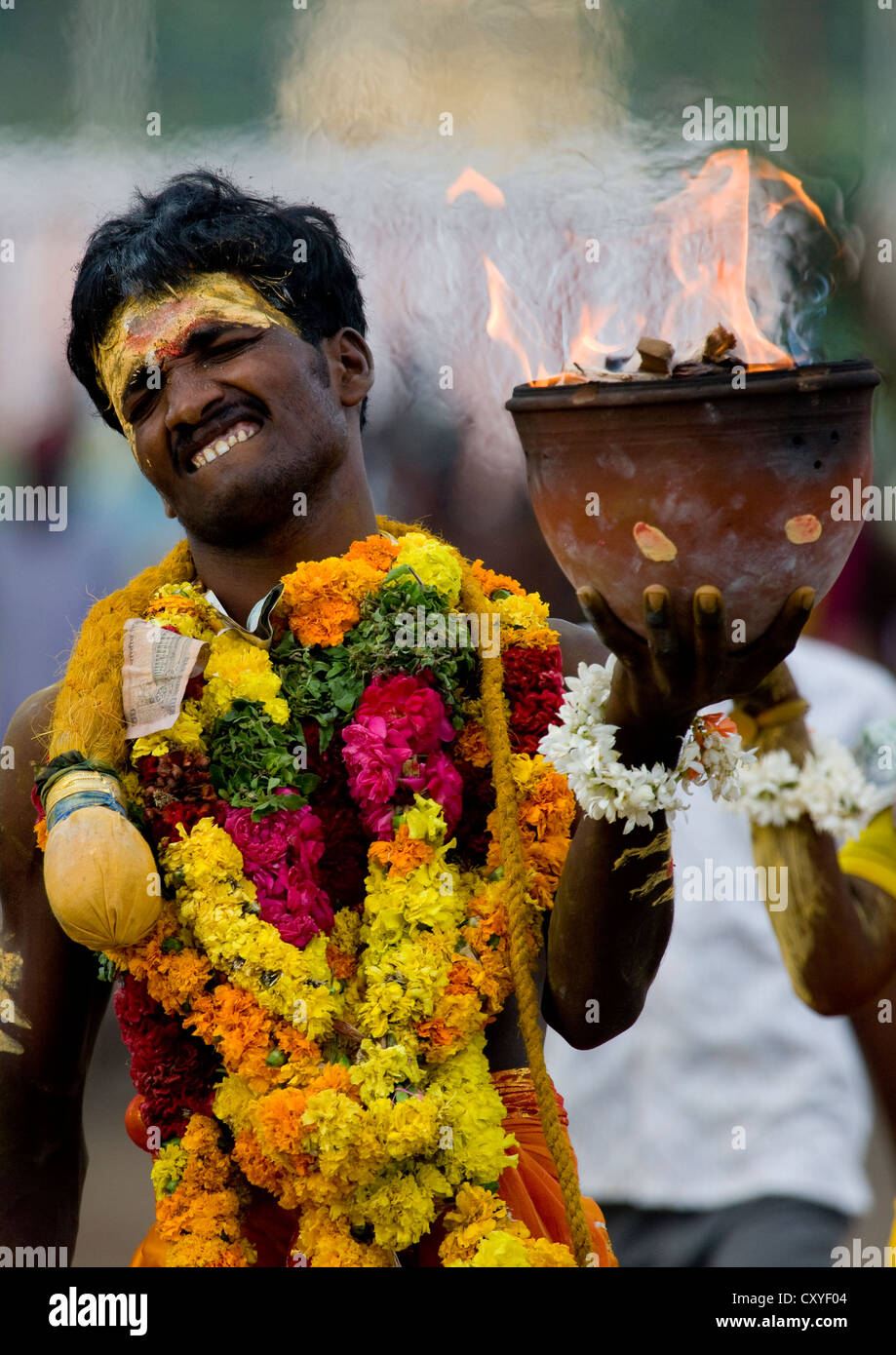 Suffering Man With Traditional Painting On His Forehead Holding A Jar ...