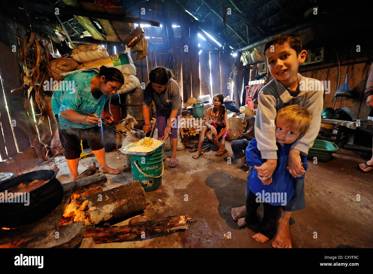 Women preparing the traditional dish "Bory Bory" in a simple kitchen on ...