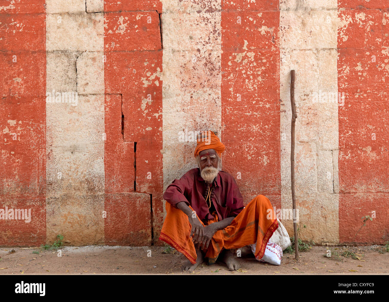 Old Sadhu Squatting In Front Of A Temple, Mahabalipuram, India Stock ...