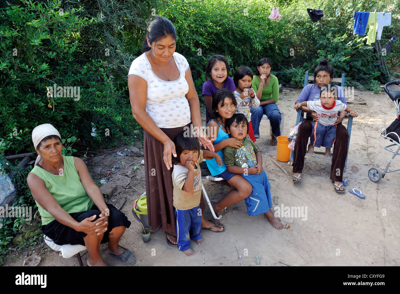 Women and children in the village of Onedi, indigenous Pilaga people ...