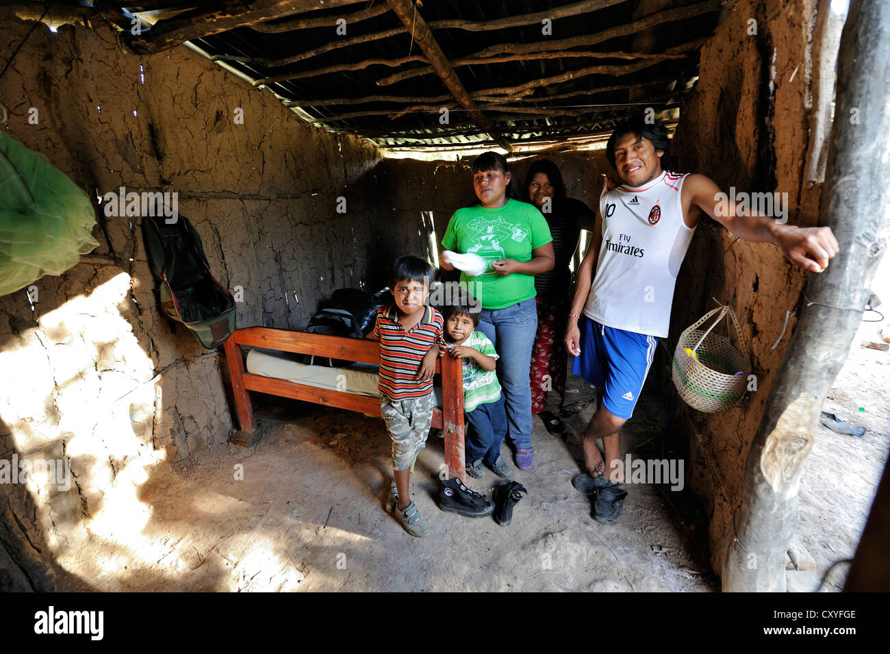 Family in a small hut, village of Onedi, indigenous Pilaga people, Gran ...