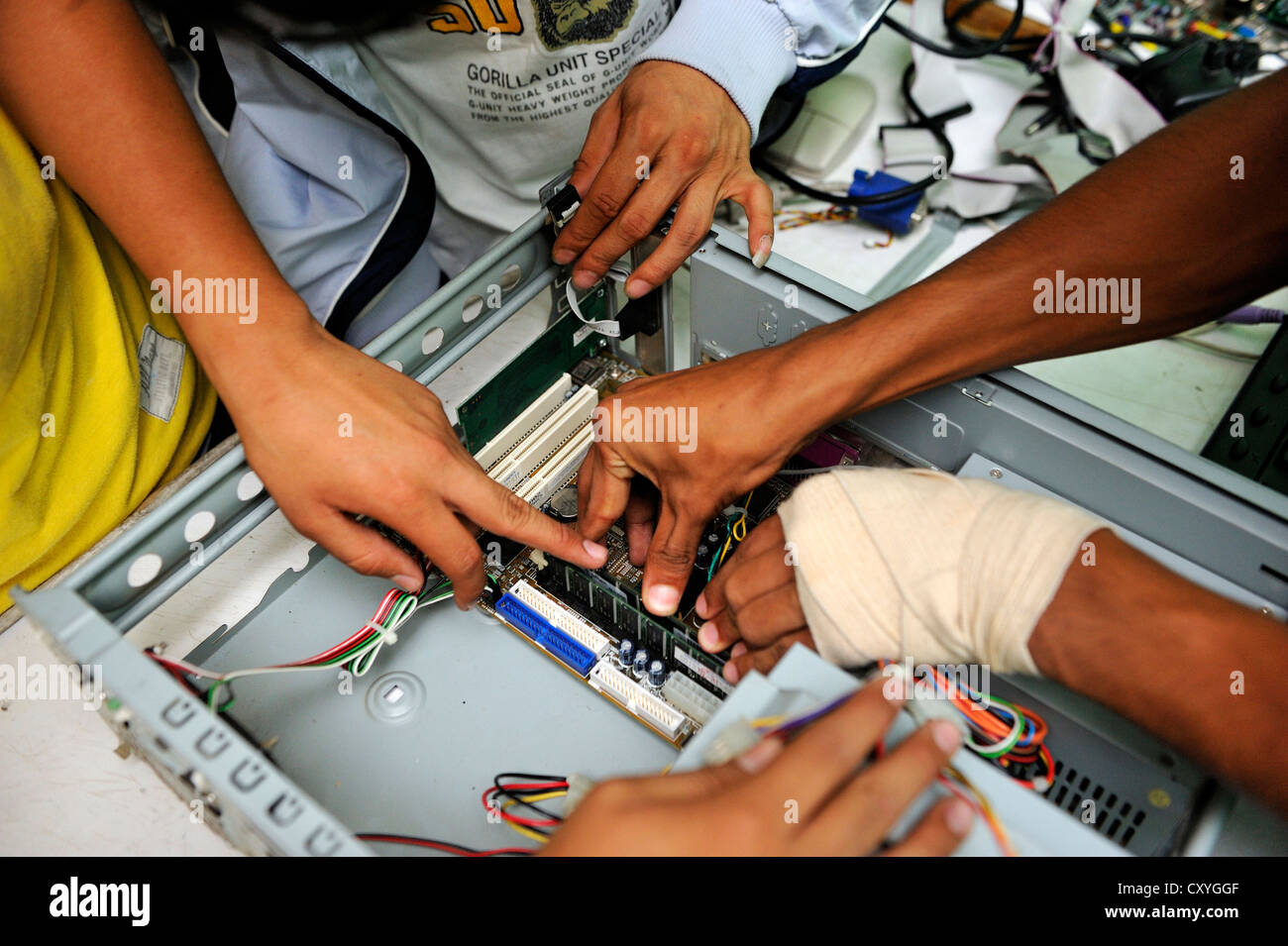 Young people assembling a computer, detailed view Stock Photo - Alamy