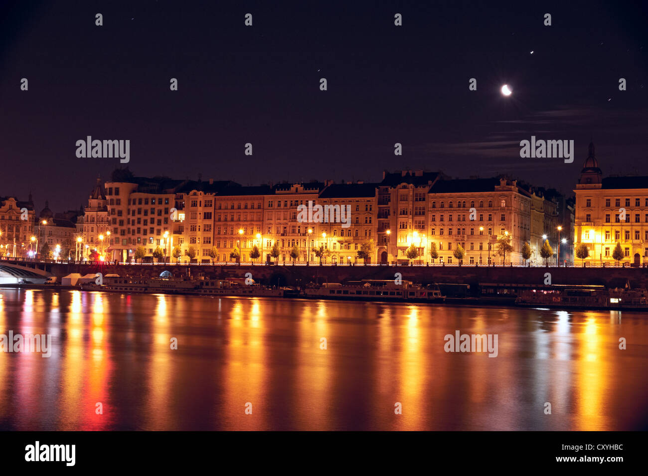 Prague at night lights through the Vltava river Stock Photo - Alamy