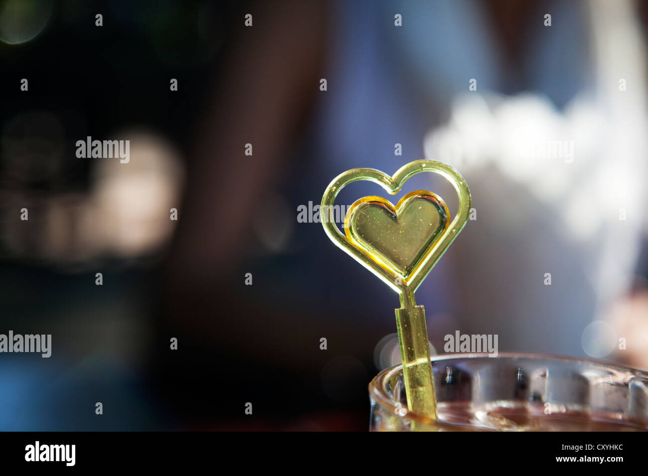 Heart drink stirrer Stock Photo - Alamy