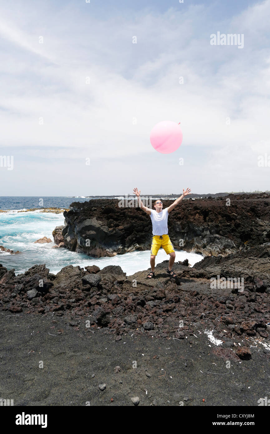Man with a balloon at the sea, freedom and lightness, Kumukahi ...