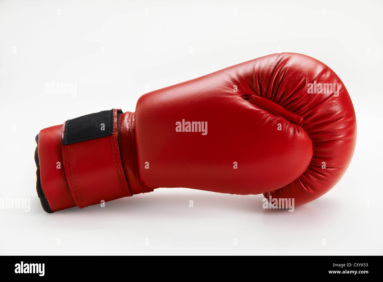 single red boxing glove isolated on white background Stock Photo - Alamy