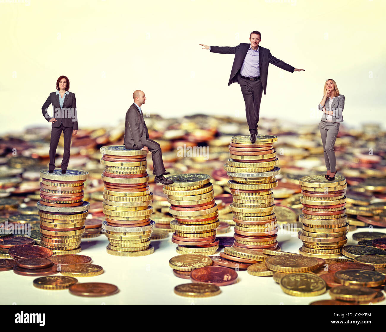 business people on euro coin piles Stock Photo - Alamy