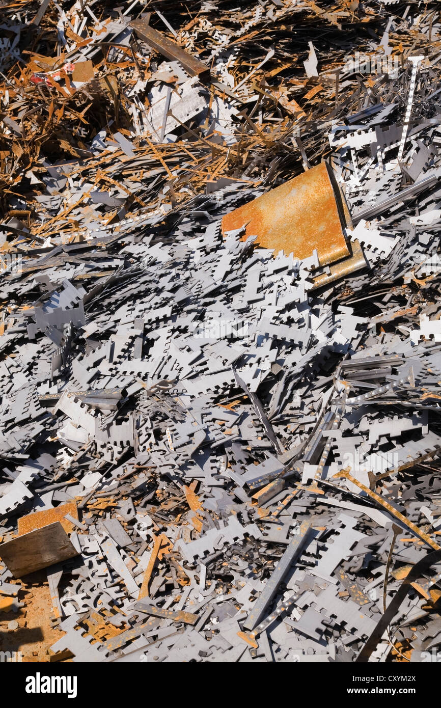 Assorted white and rusted metal brackets at a scrap metal recycling ...