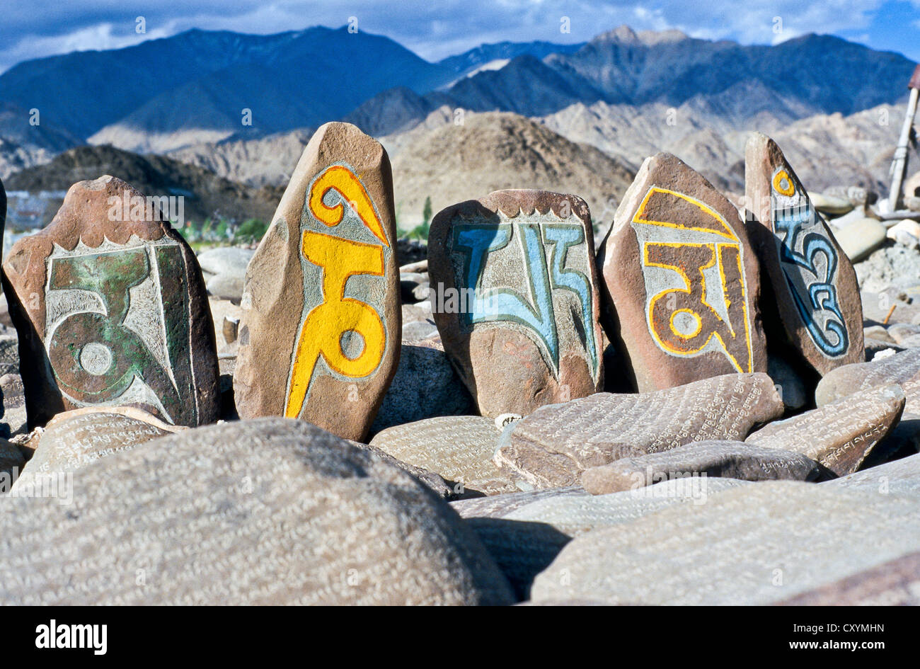 Mani stones with the Buddhist mantra of Avalokiteshwara, the Om Mani ...