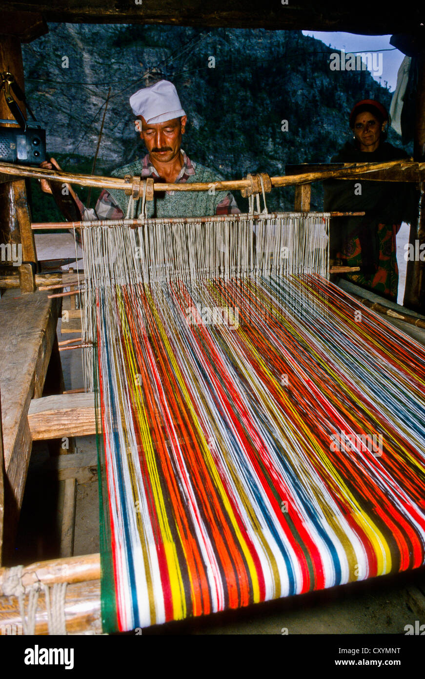 Man weaving colourful material, remote village of Pangi, India, Asia ...