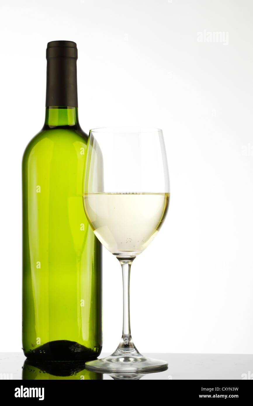 bottle with white wine and glass Stock Photo - Alamy