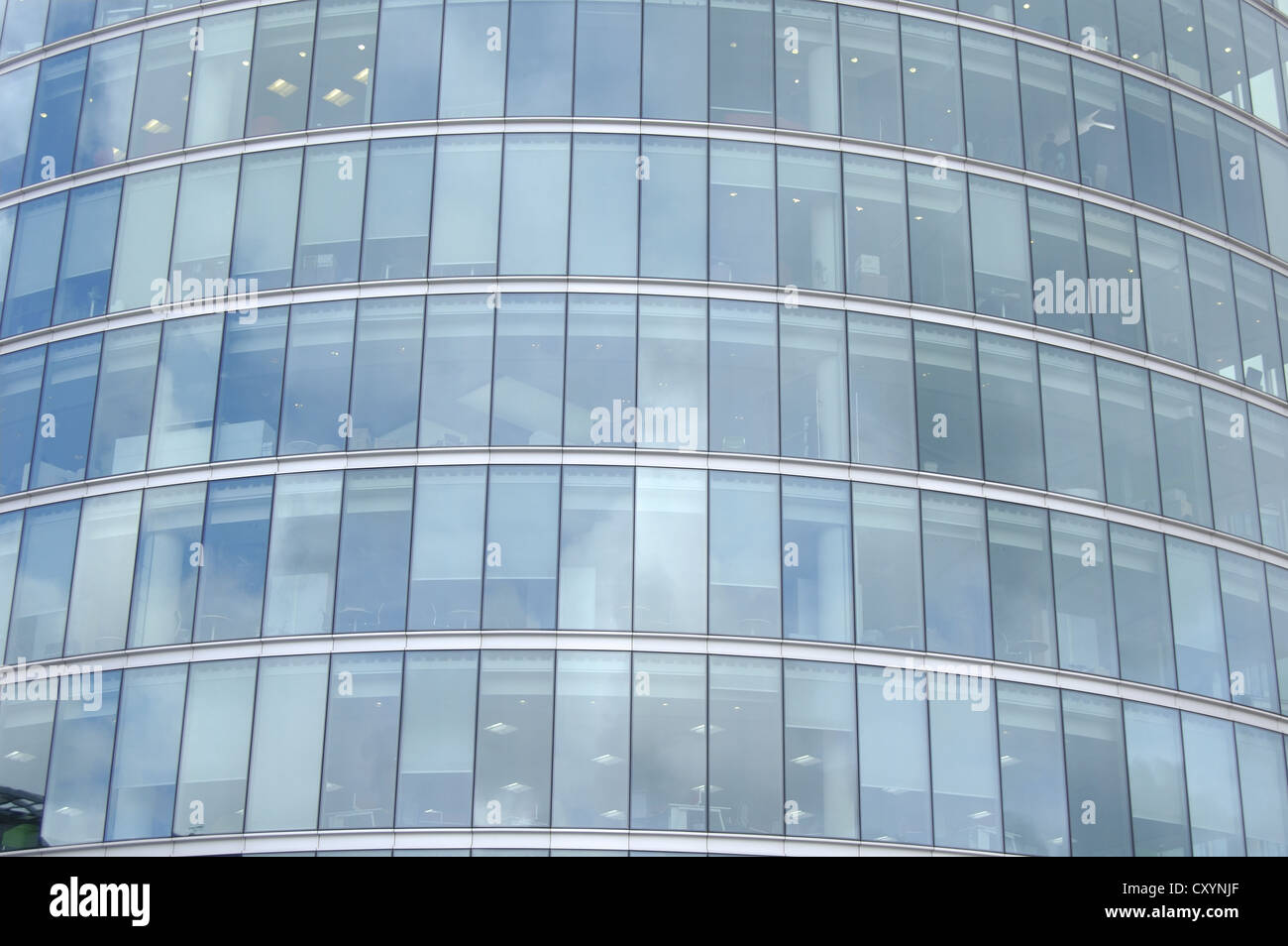 Reflection on glass facade of a modern office building Stock Photo - Alamy