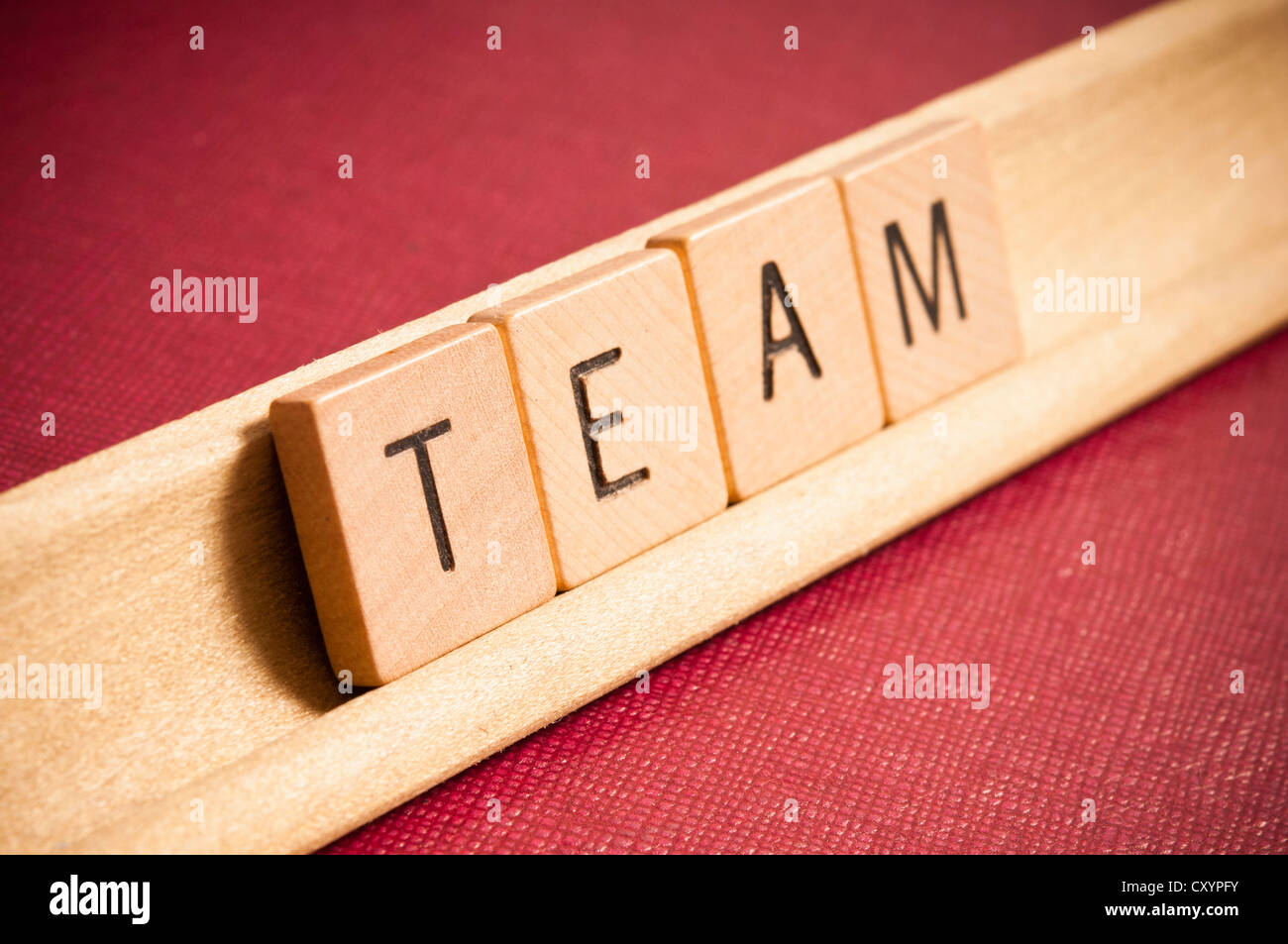 team spelled with scrabble tiles Stock Photo - Alamy