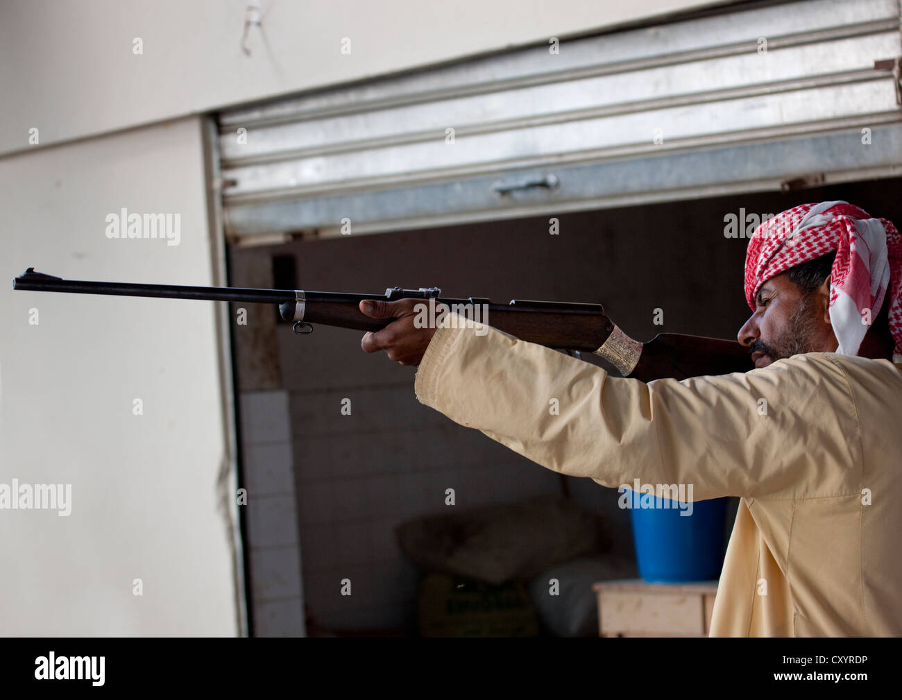 Man Testing A Gun In The Weapons Souk, Sinaw, Oman Stock Photo - Alamy