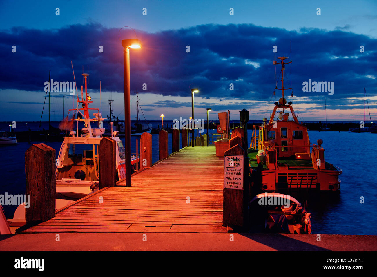 Pilot boat and a small rescue boat at the pier in the harbor, in the ...