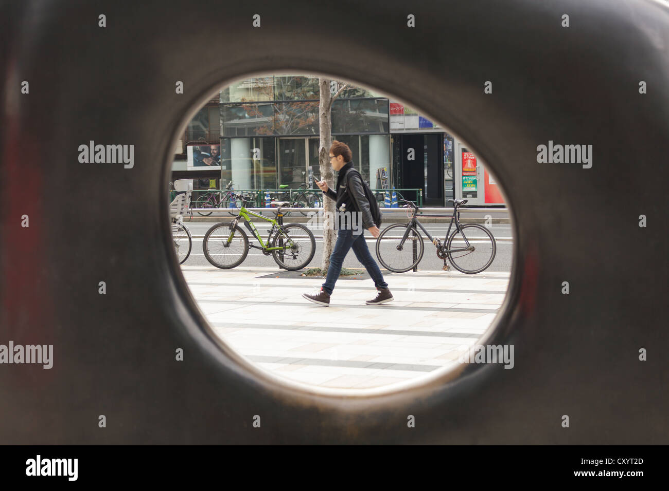 man walking in Tokyo, view from inside city modern sculpture, Tokyo ...