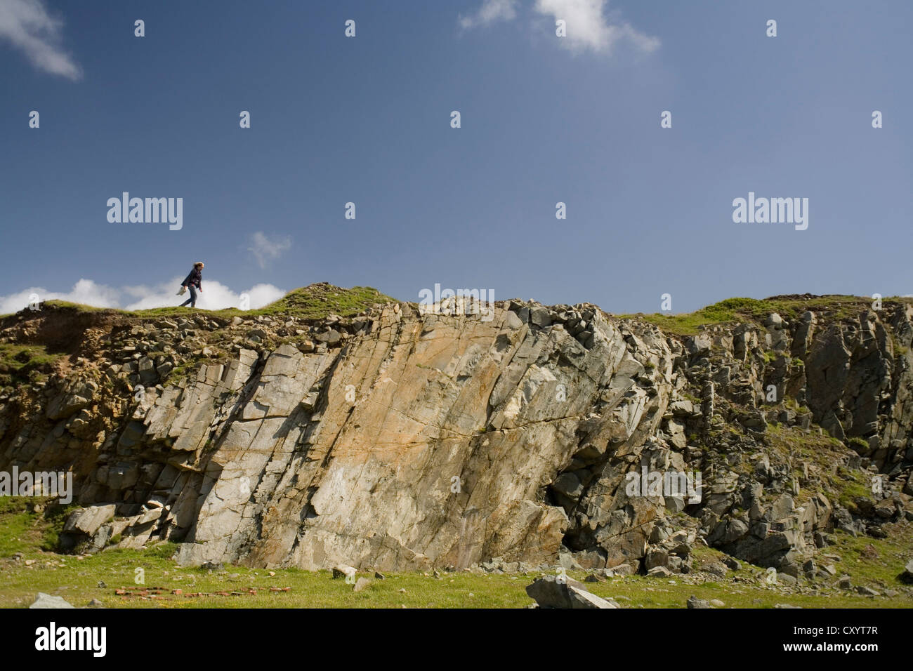 Young woman walking on cliff top in Wales Stock Photo - Alamy