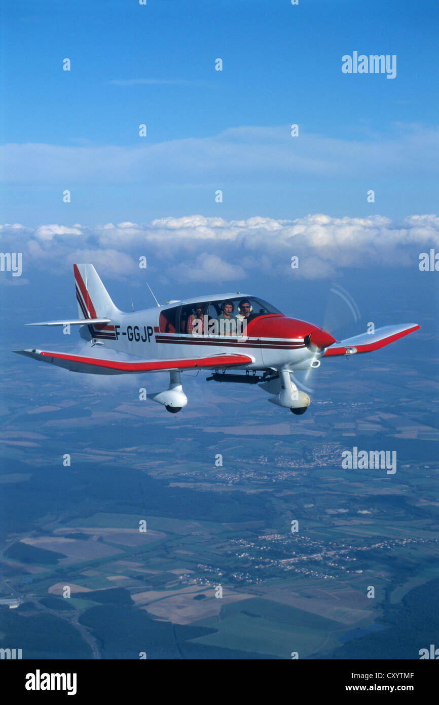 French plane Robin DR400-180 in flight over clouds, France Stock Photo ...