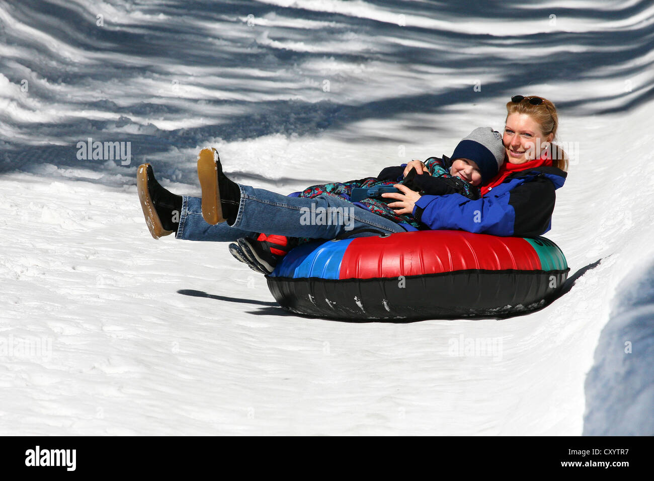 Mother, 35 years, and son, 4 years, snowtubing, snow tubing, winter ...