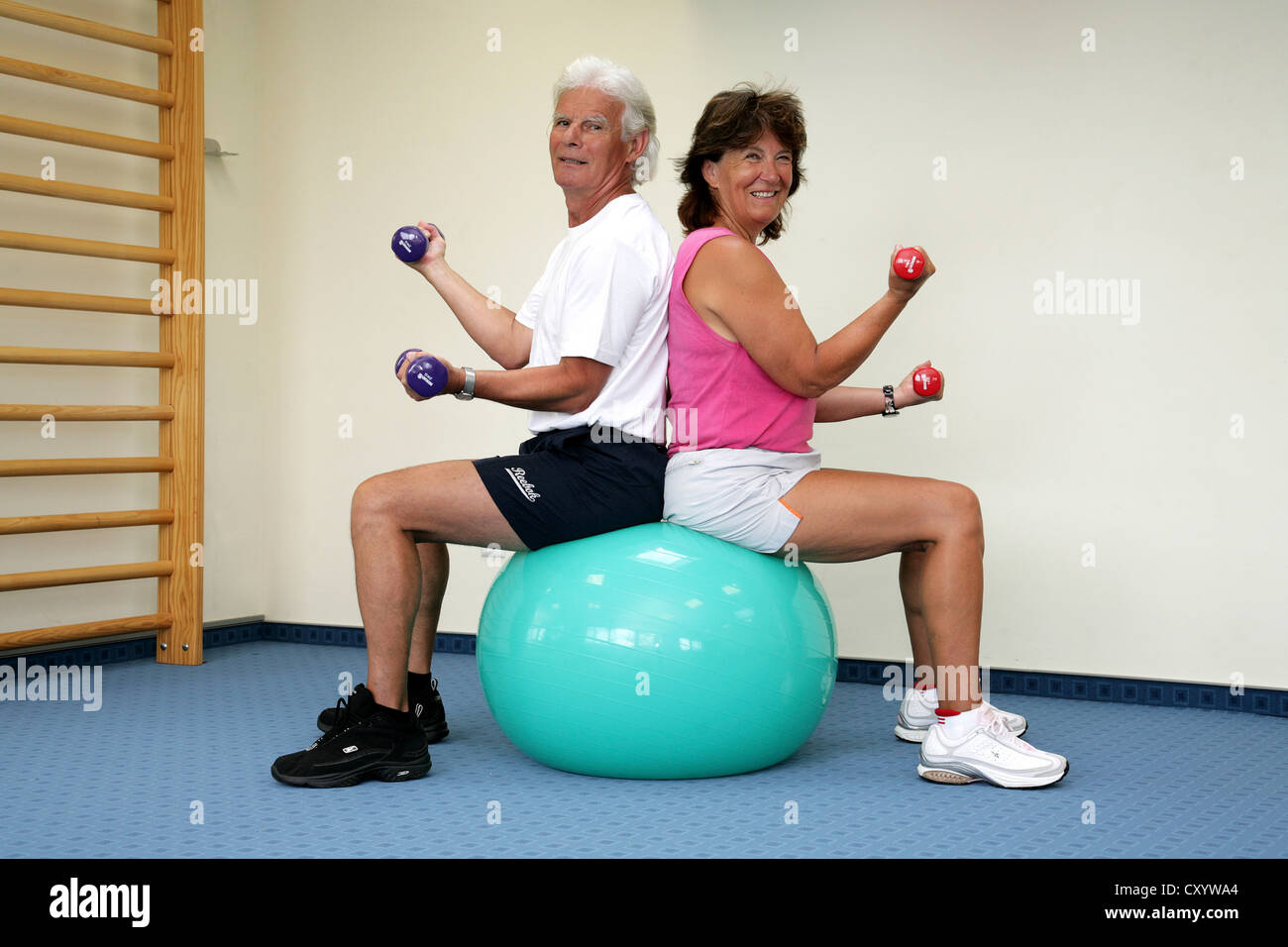 Sportive senior man doing exercises and sports in gym hi-res stock ...