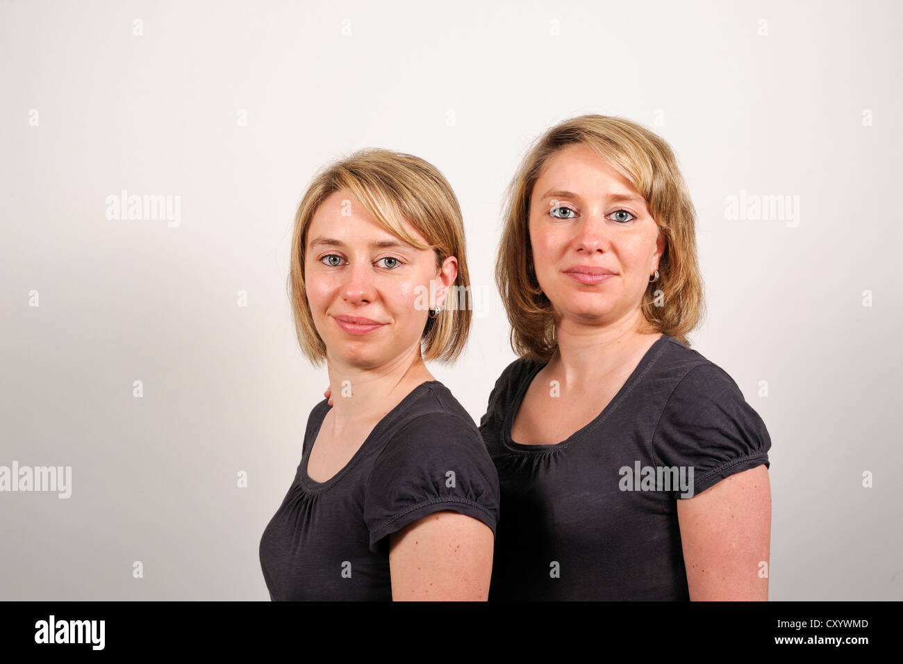 Twin sisters, portrait Stock Photo - Alamy