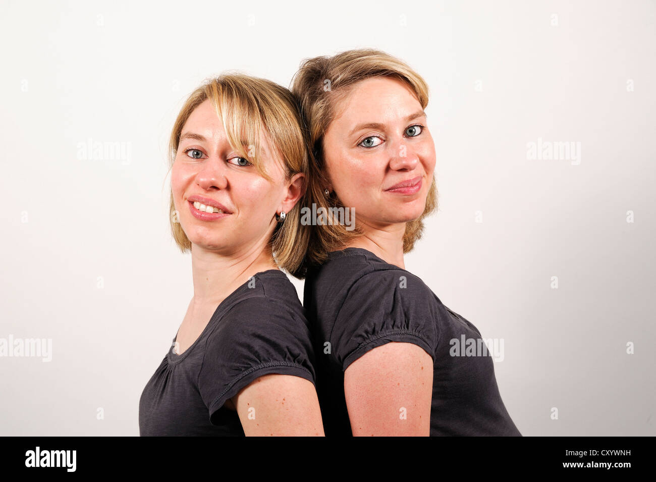 Twin sisters, portrait Stock Photo - Alamy