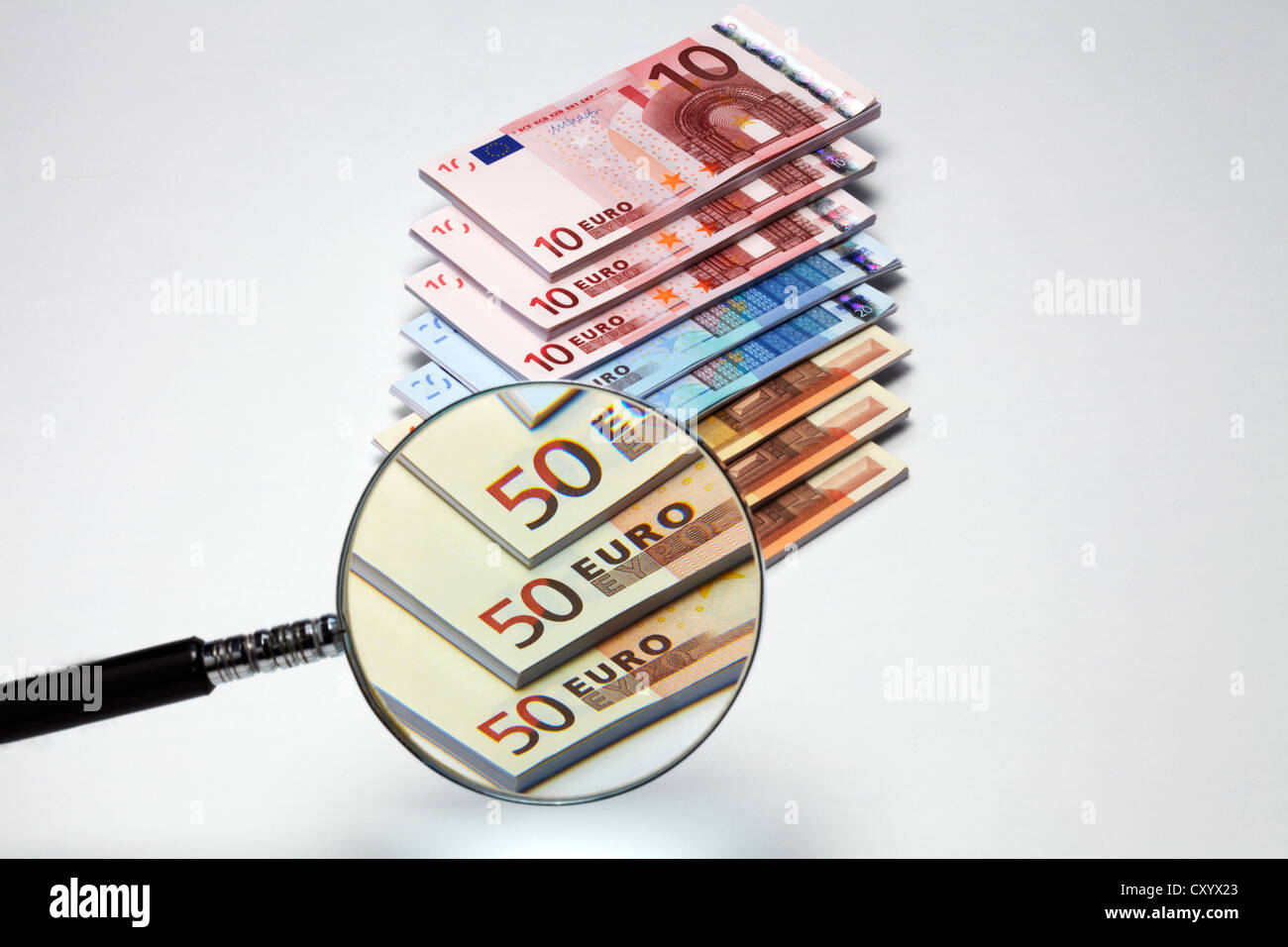 Stack of Euro Notes Under Magnifying Glass Stock Photo - Alamy