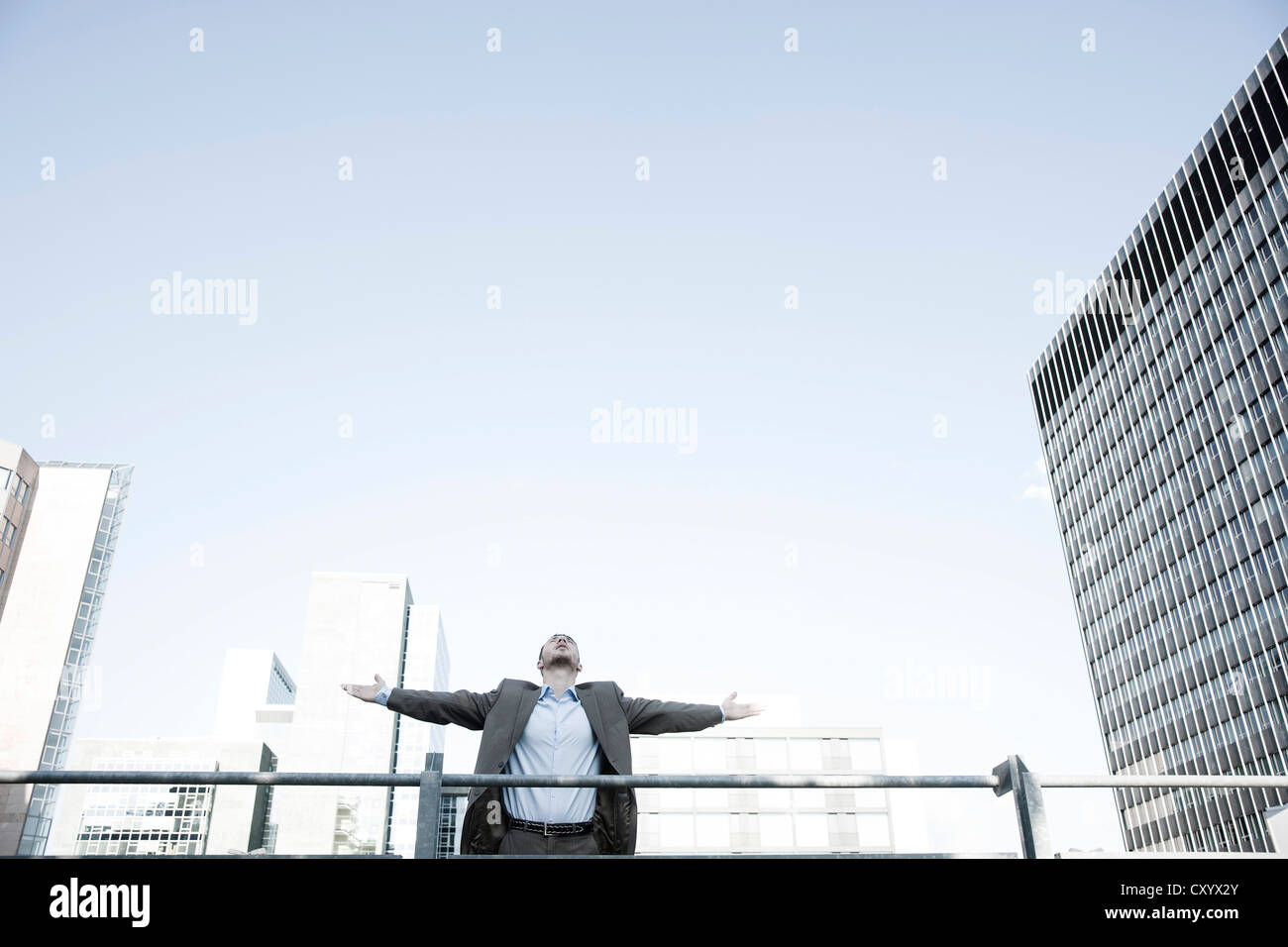 Young man spreading arms hi-res stock photography and images - Alamy