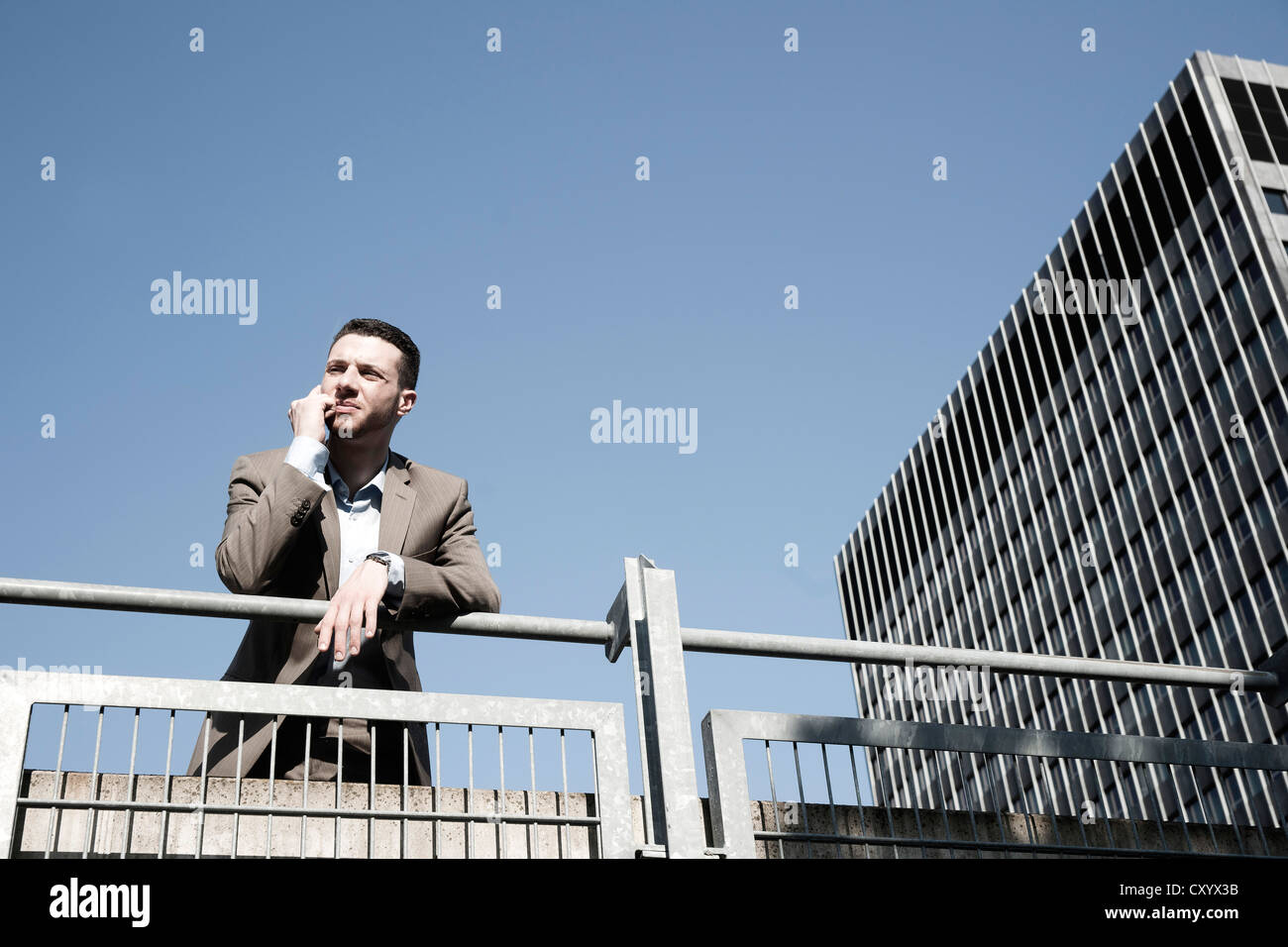 Old man leaning railings hi-res stock photography and images - Alamy