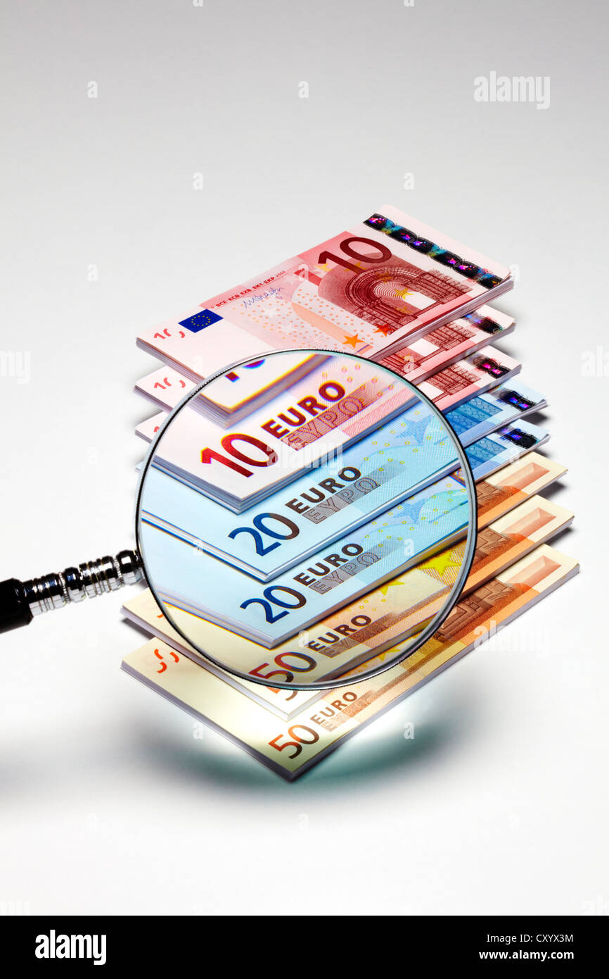 Stack of Euro Notes Under Magnifying Glass Stock Photo - Alamy