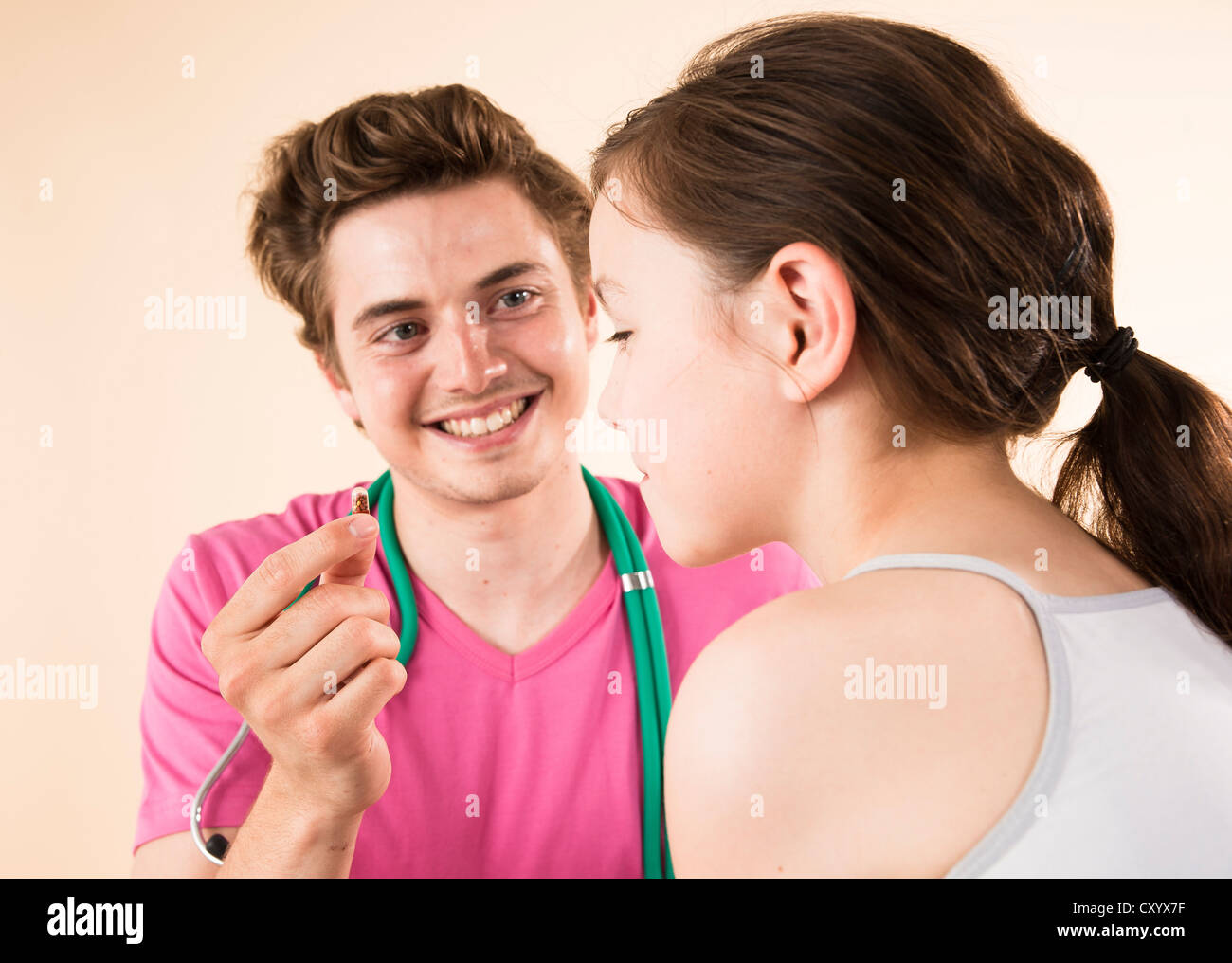Girl receiving medication from her pediatrician Stock Photo - Alamy