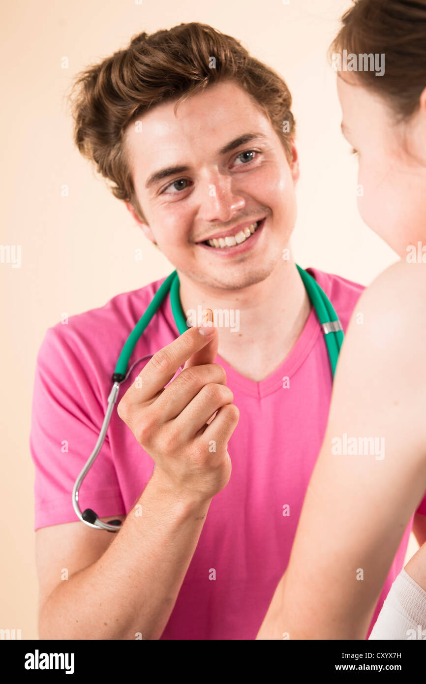 Girl receiving medication from her pediatrician Stock Photo - Alamy
