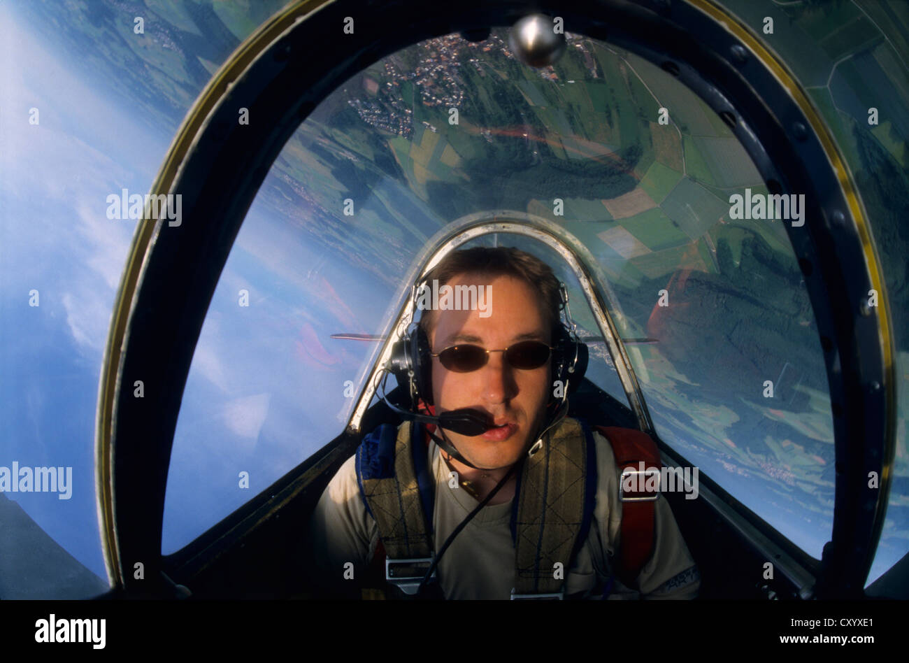 Inside view of pilot during aerobatic flight with Yak-52 Russian plane ...